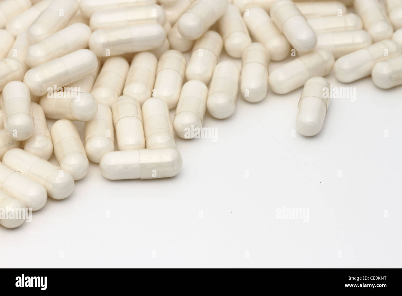 medicinal capsules on white Stock Photo - Alamy