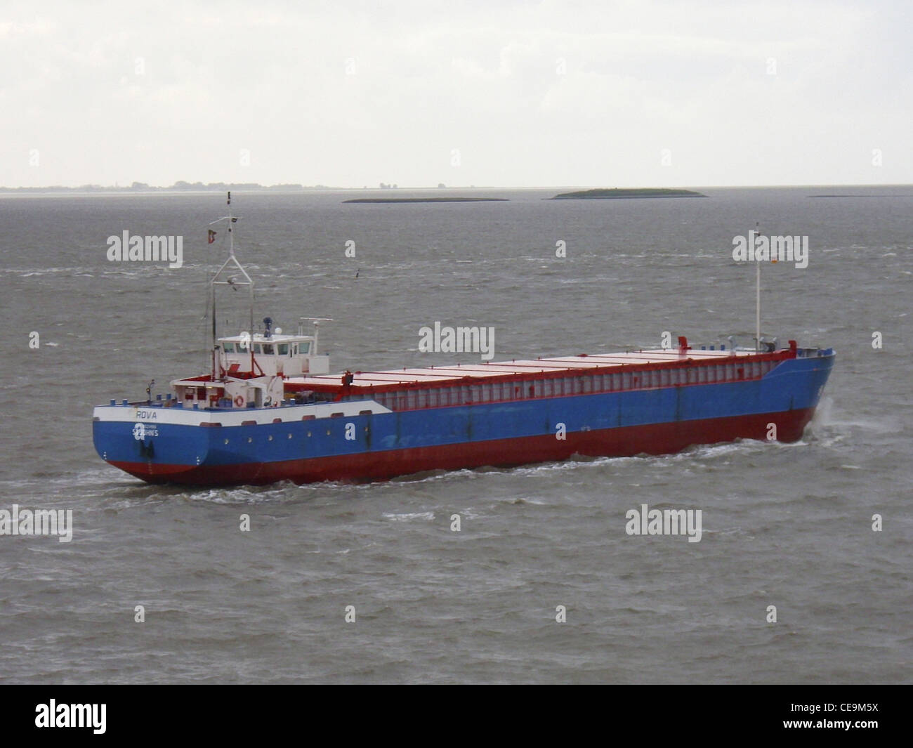 The general cargo ship Rova is seen outbound on the River Weser, a ...