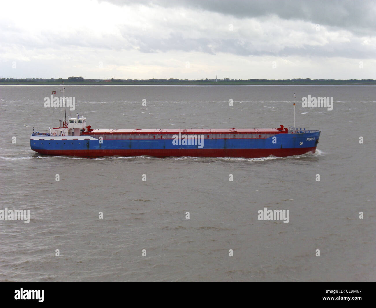 The general cargo ship Rova is outbound on the river Weser, Germany ...