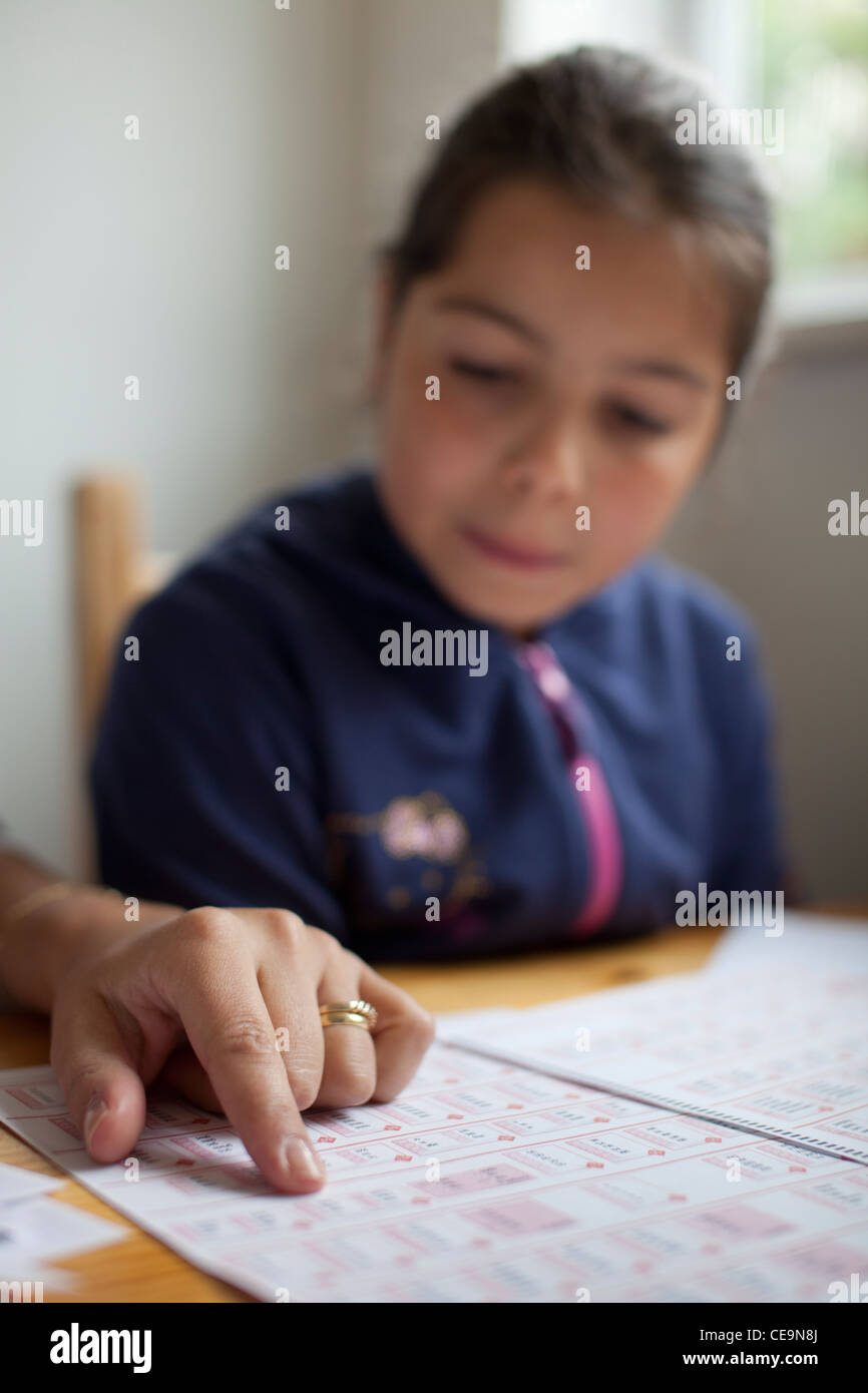 Tutor teaching private lessons to a young child Stock Photo - Alamy