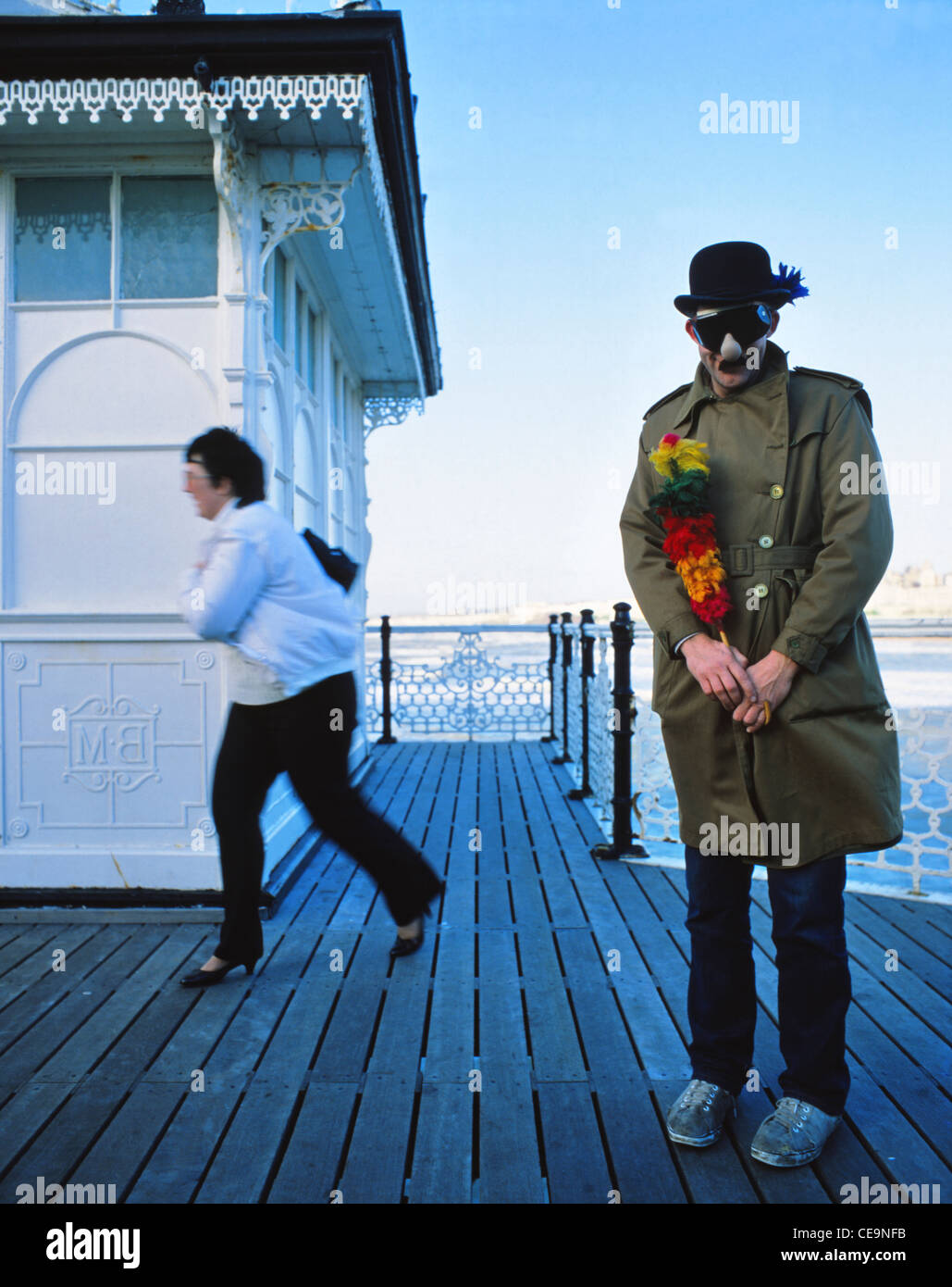 Brighton Pier (formerly Palace Pier) circa 1983, an eccentric man poses ...