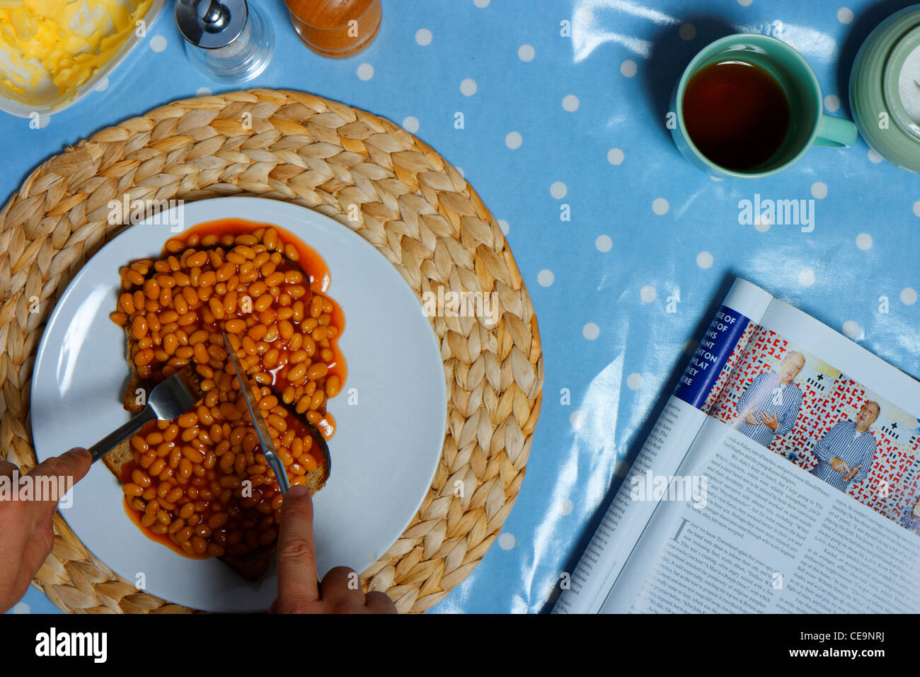 Man eats breakfast beans on toast with coffee Stock Photo - Alamy