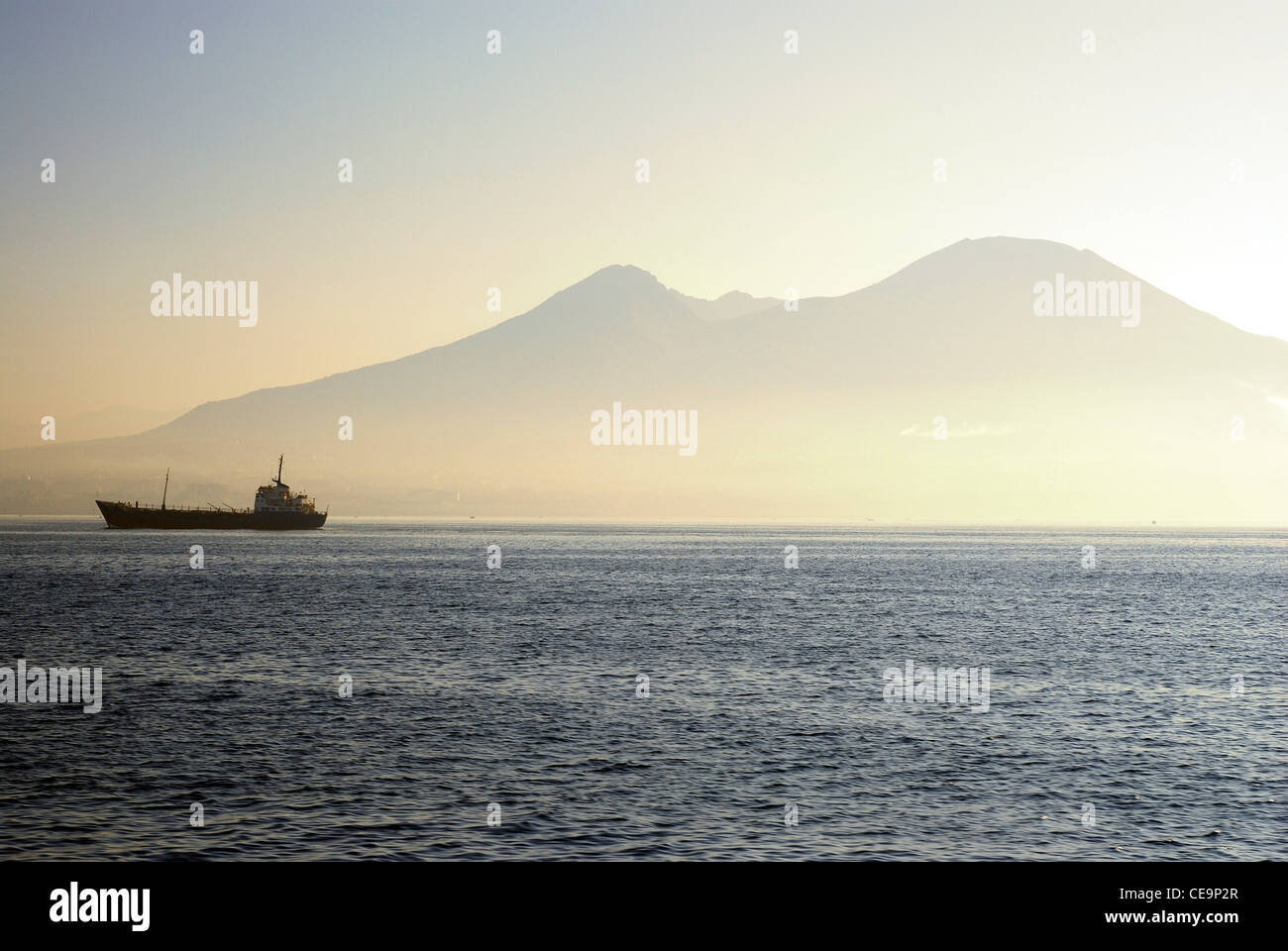 Ferry on a sea with Mount Vesuvius in background Stock Photo - Alamy