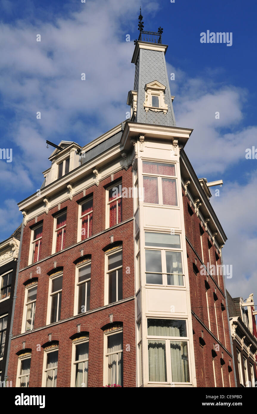 Corner building in Amsterdam (Netherlands) with traditional ancient ...
