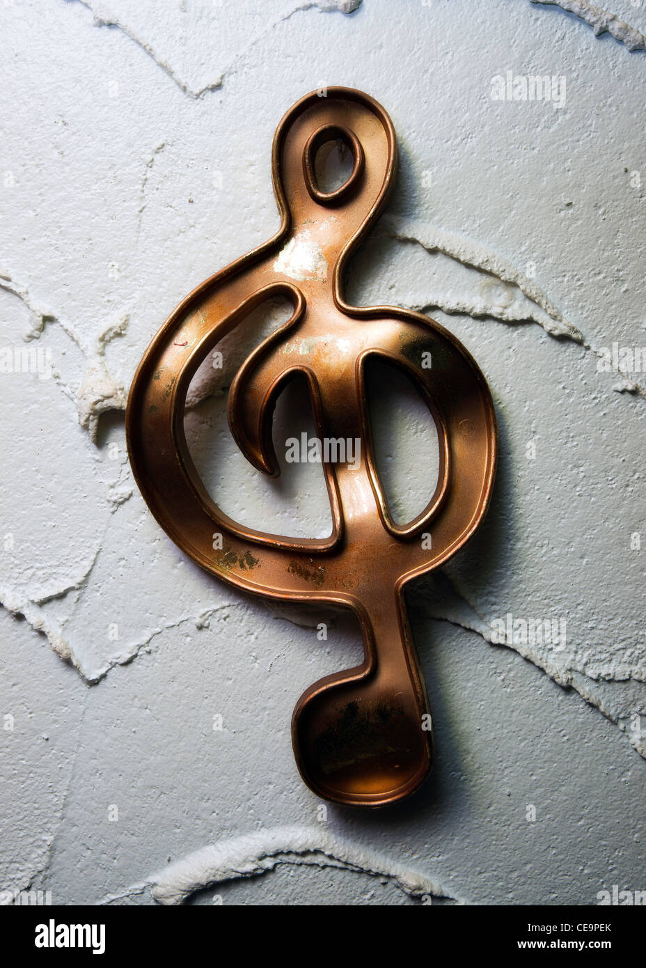 A treble-clef musical symbol on plastered wall Stock Photo - Alamy