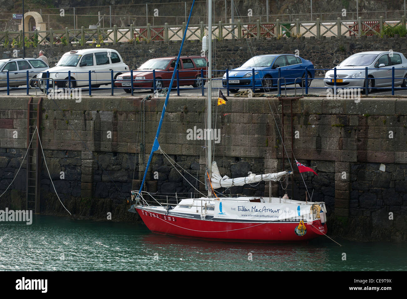 A yacht on the wall of Portpatrick harbour a small harbor and village ...