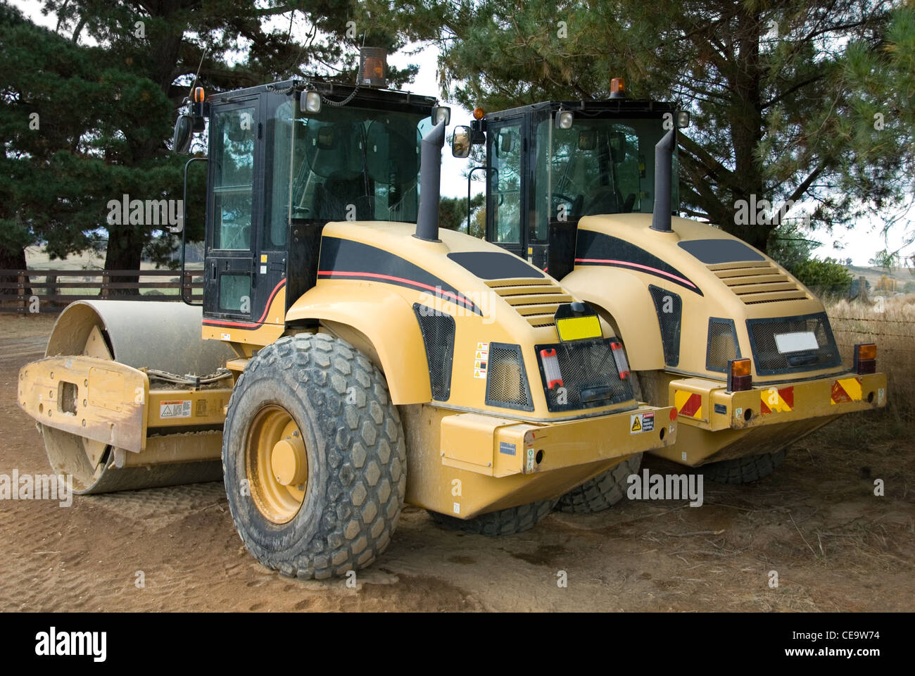 Two road rollers parked on the side of a road in country New South ...