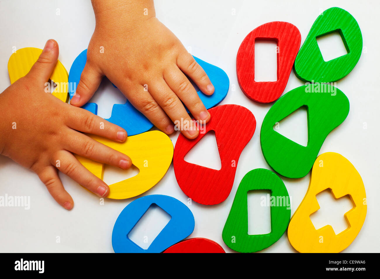 hands of the child solve the problem of the game Stock Photo - Alamy