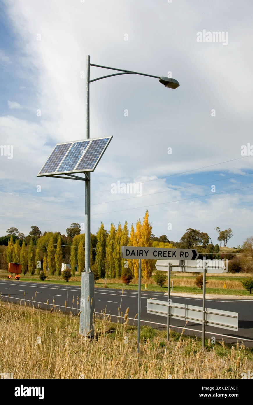 A solar panel attached to a street light adjacent to a road near Orange ...