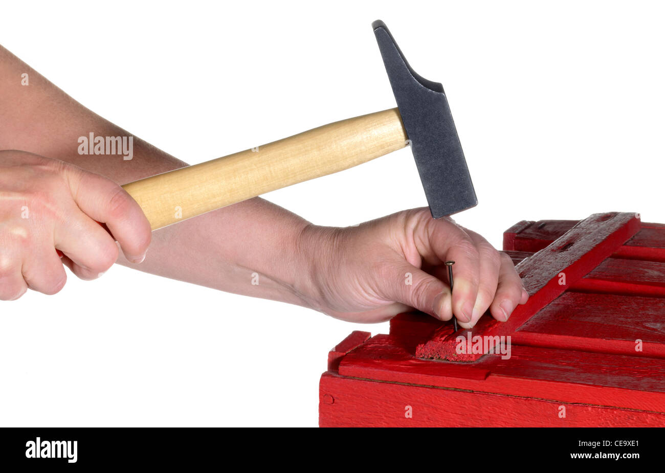a hammering hand in white back Stock Photo - Alamy
