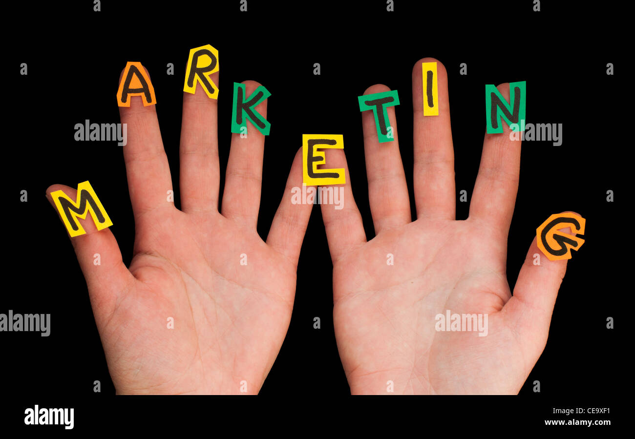 Word Marketing made from letters cut out. Two hands Stock Photo - Alamy