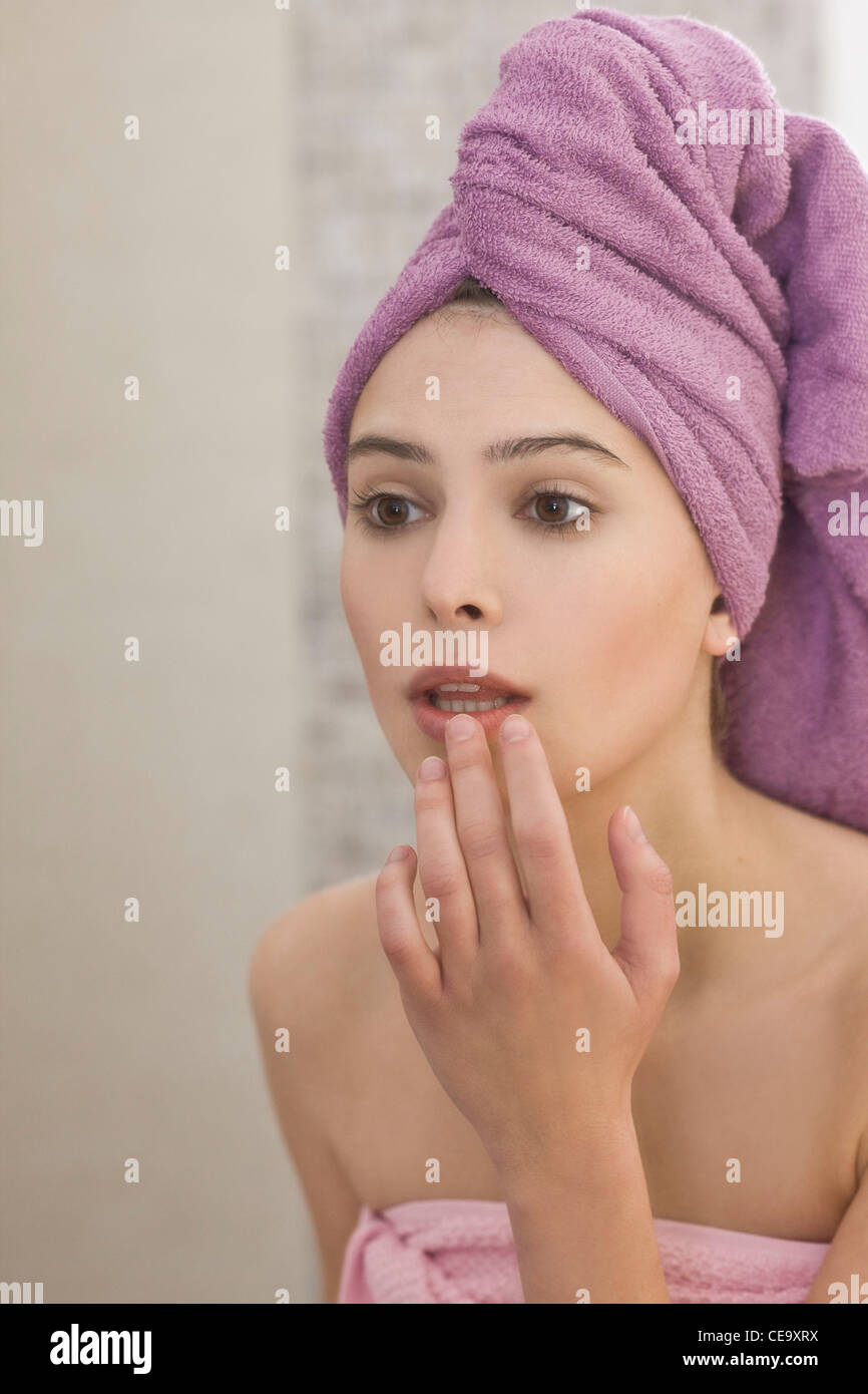 Woman applying ointment on lips Stock Photo - Alamy
