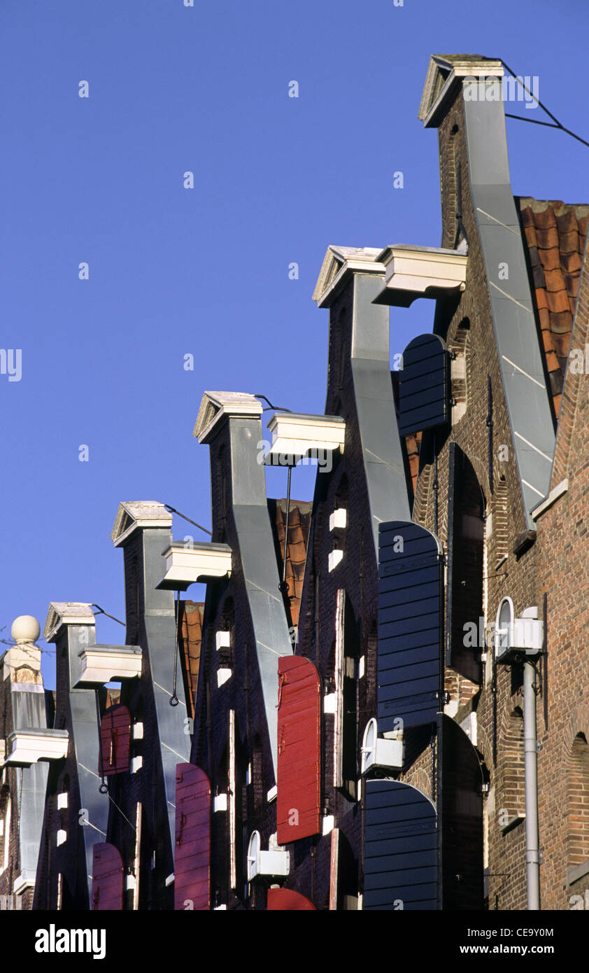 Hooks and beams are used for hoisting furniture on old Dutch buildings ...