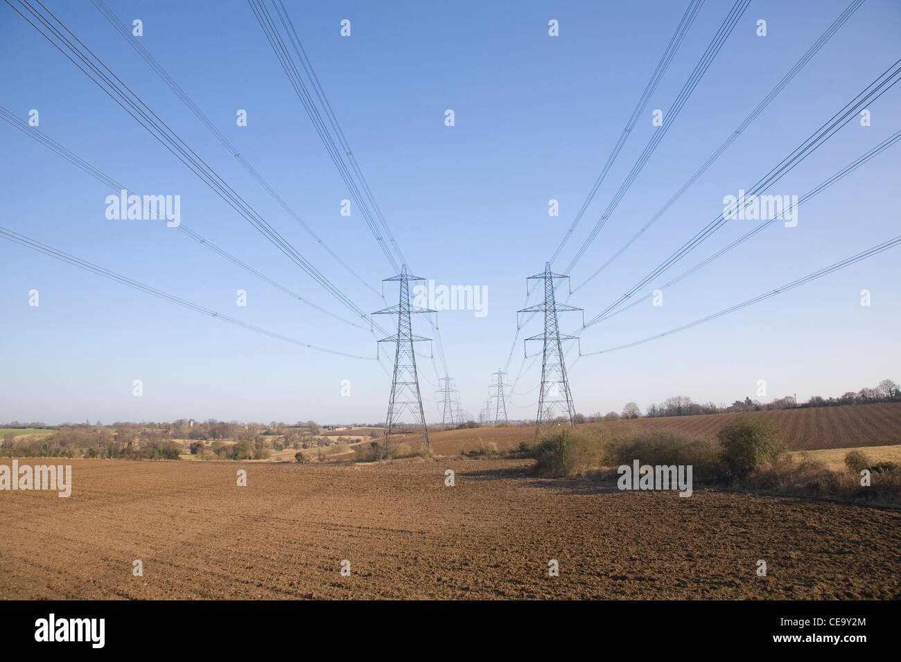 Power transmission lines pylons crossing fields near Claydon, Suffolk ...