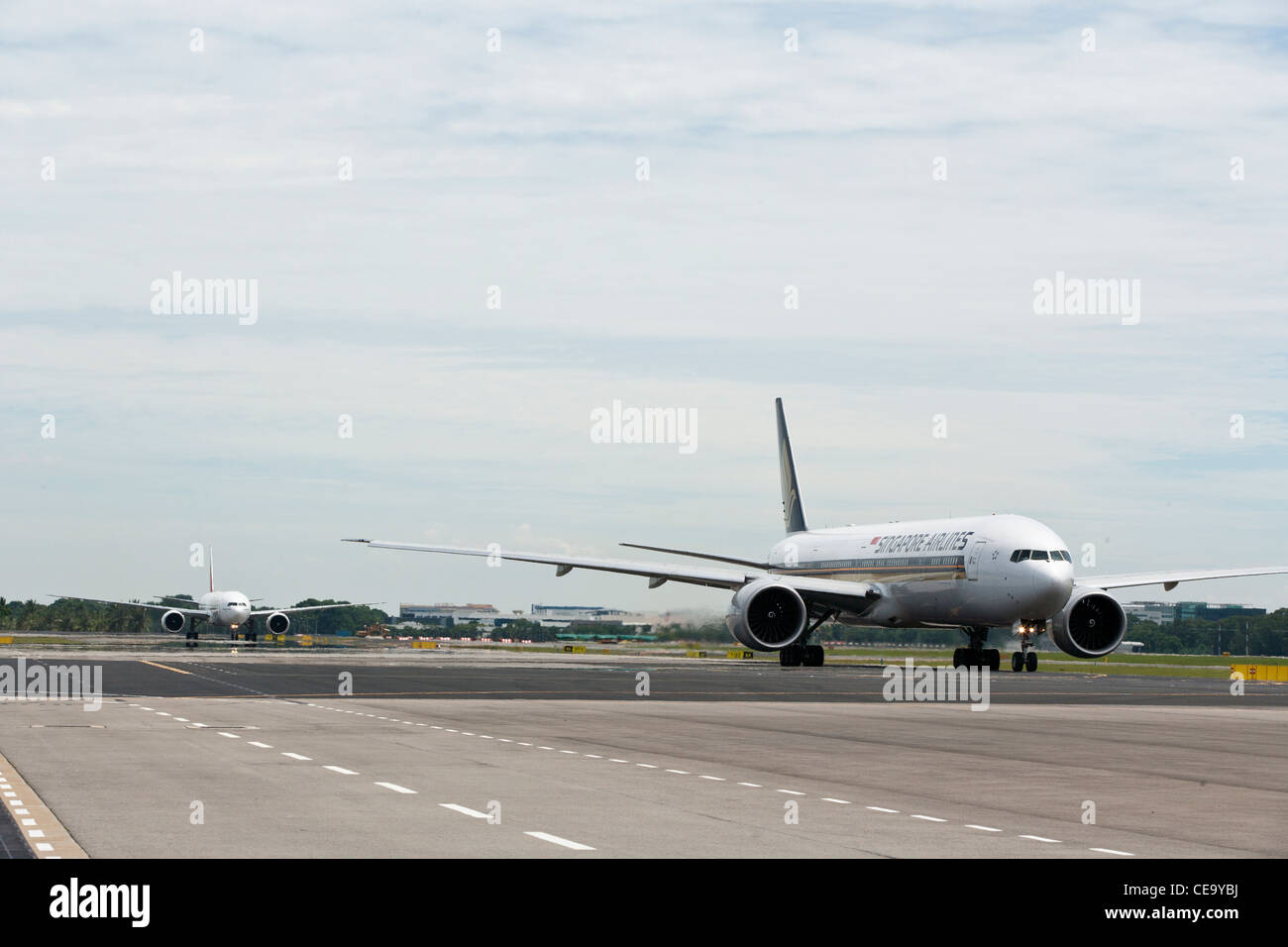 Singapore Airlines Ltd. jets taxi to the runway at Changi airport in ...