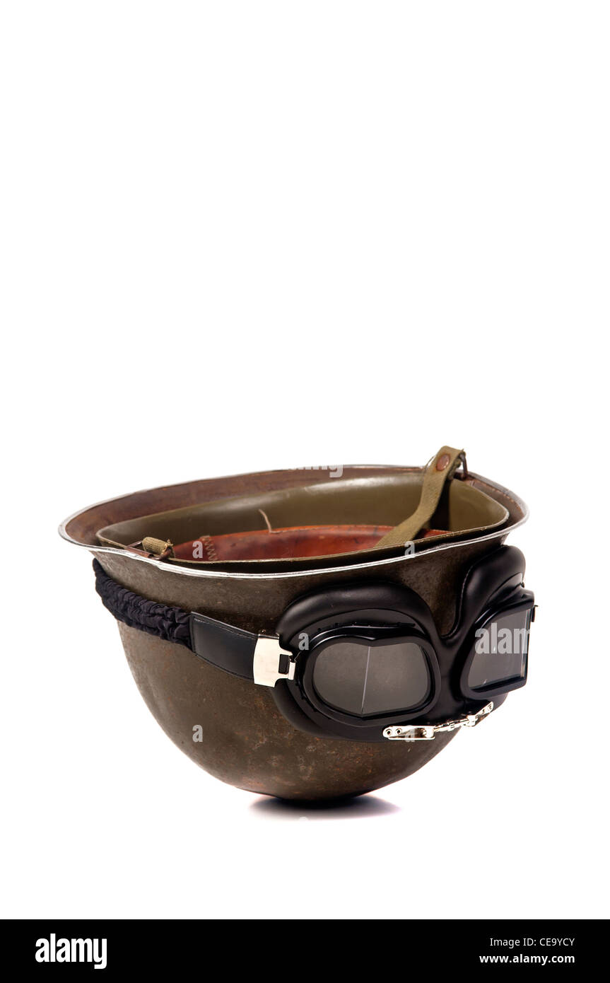 Old soldiers helmet with goggles isolated in white Stock Photo - Alamy