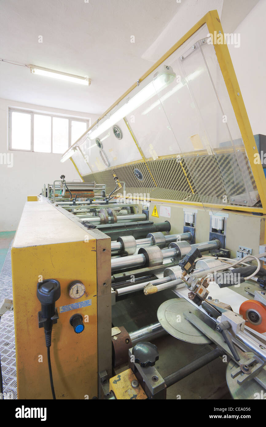 Interior of a factory, old machine for printing Stock Photo - Alamy