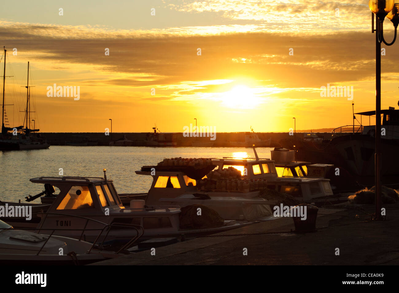 Harbor at sunset Stock Photo - Alamy