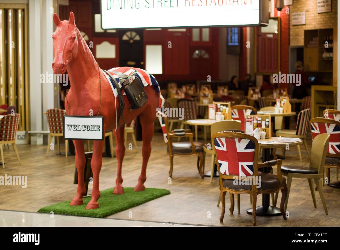 Model red horse and red telephone box in Heathrow Airport London ...