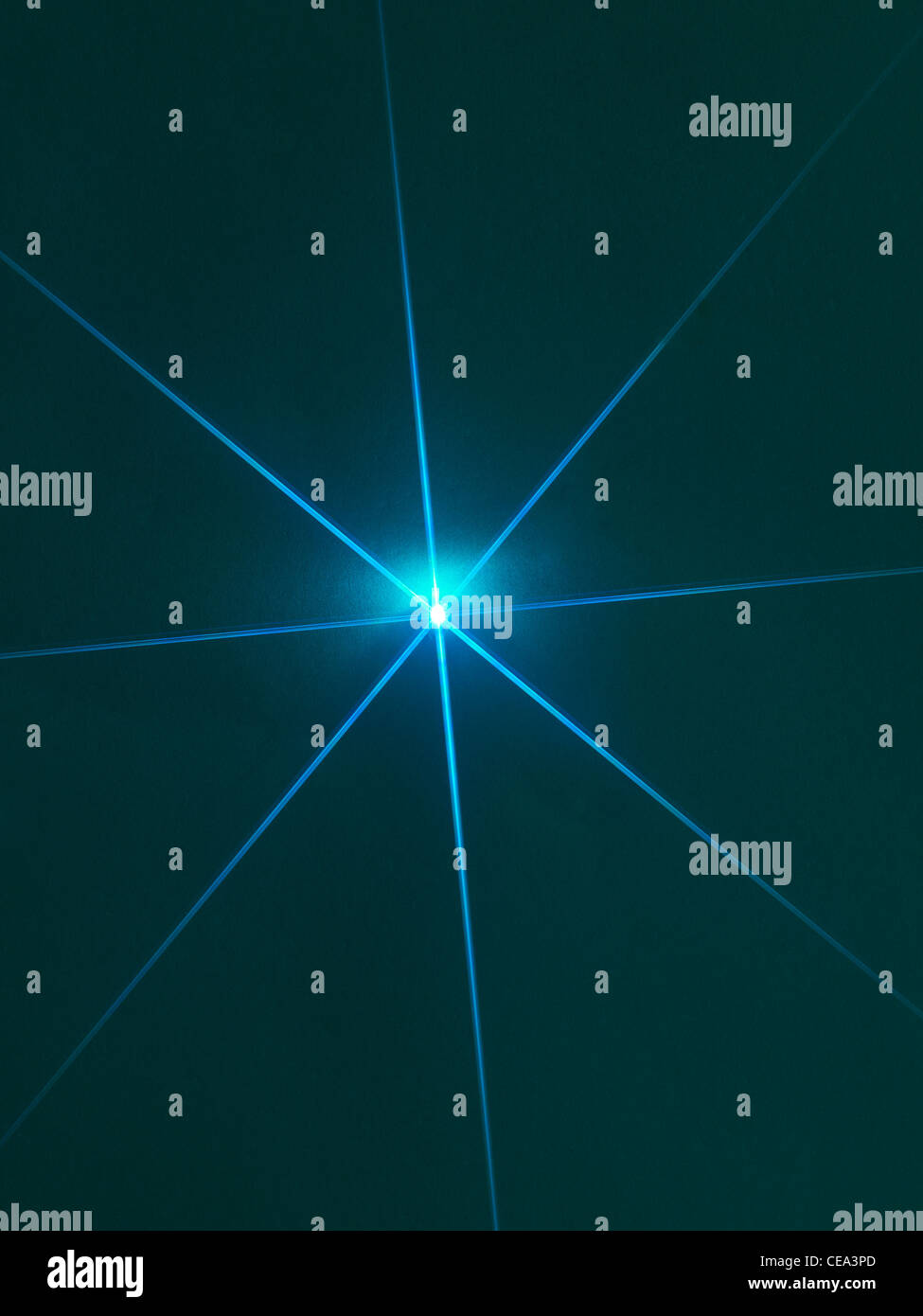 A still life shot of a single point of blue laser light Stock Photo - Alamy