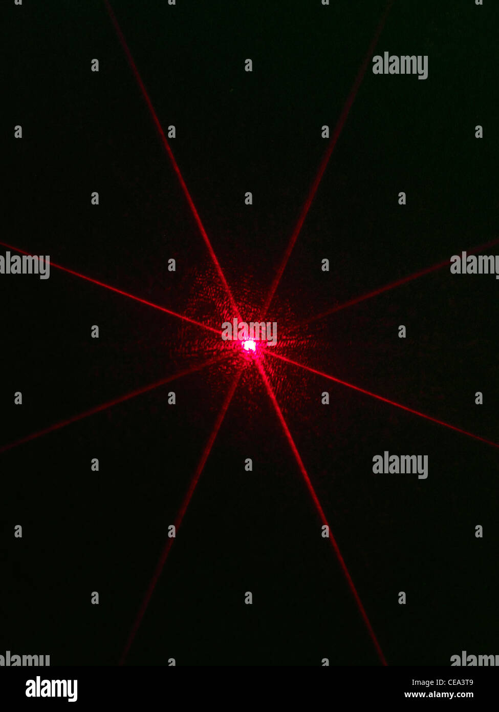 A still life shot of a single point of red laser light Stock Photo - Alamy