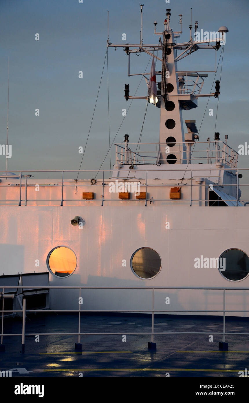 Sunrise illuminating the bridge of the MV Amorique as it approaches ...