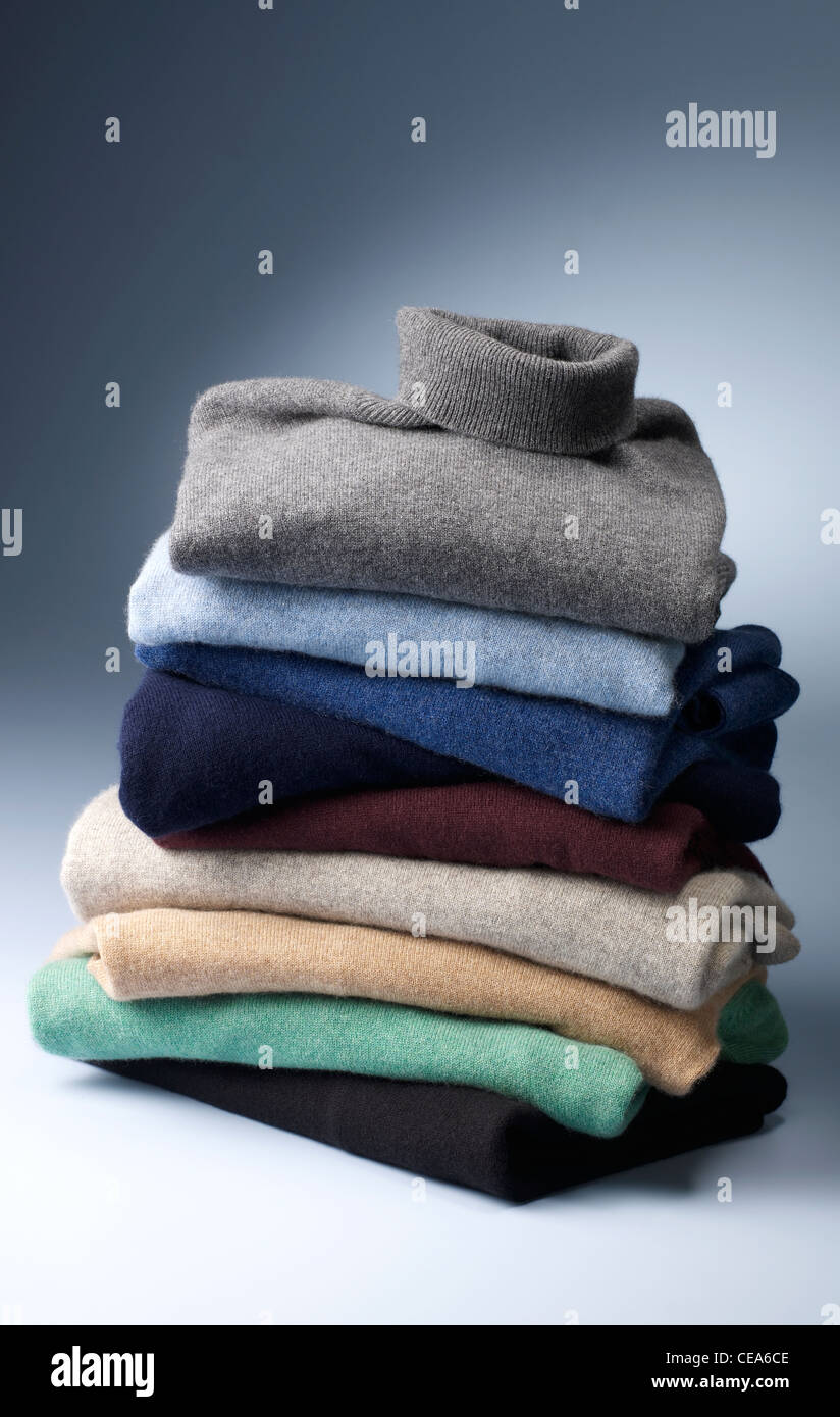 still life shot of neatly stacked colorful womens jumpers Stock Photo ...