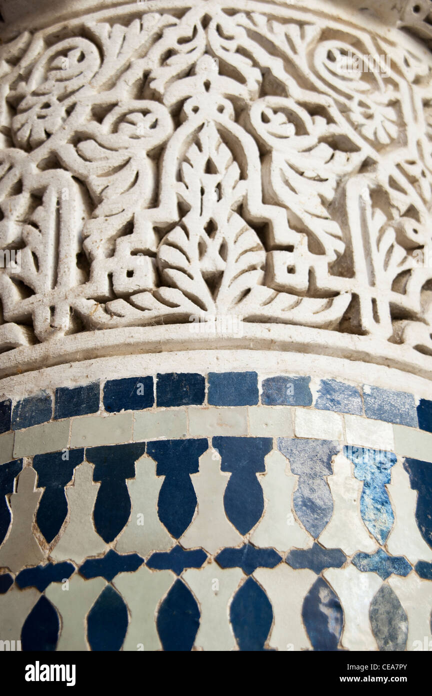 Traditional ornate plaster work and mosaic tiles inside a Riad. Fez in ...