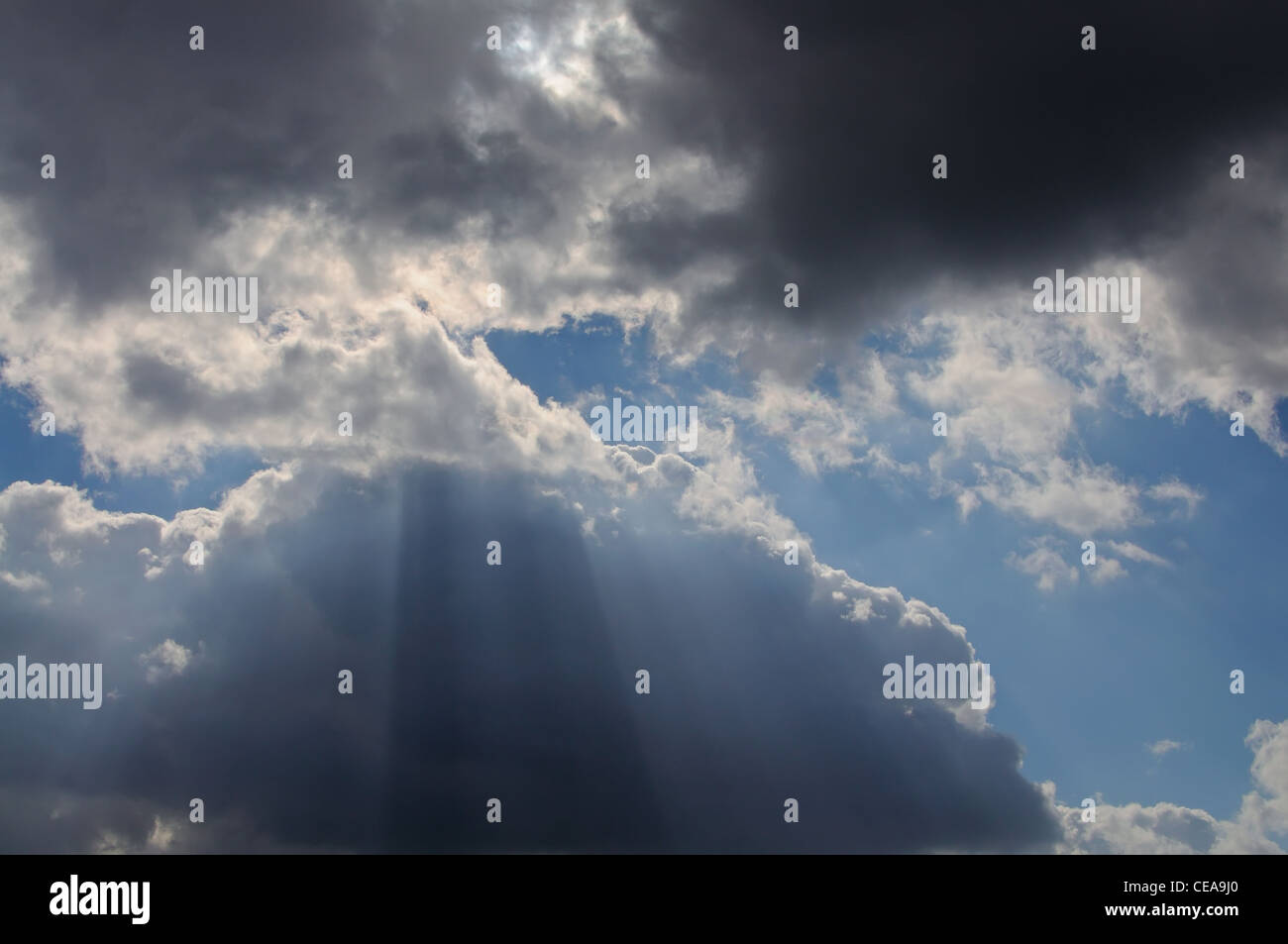 Rays of the sun breaking through storm clouds Stock Photo - Alamy