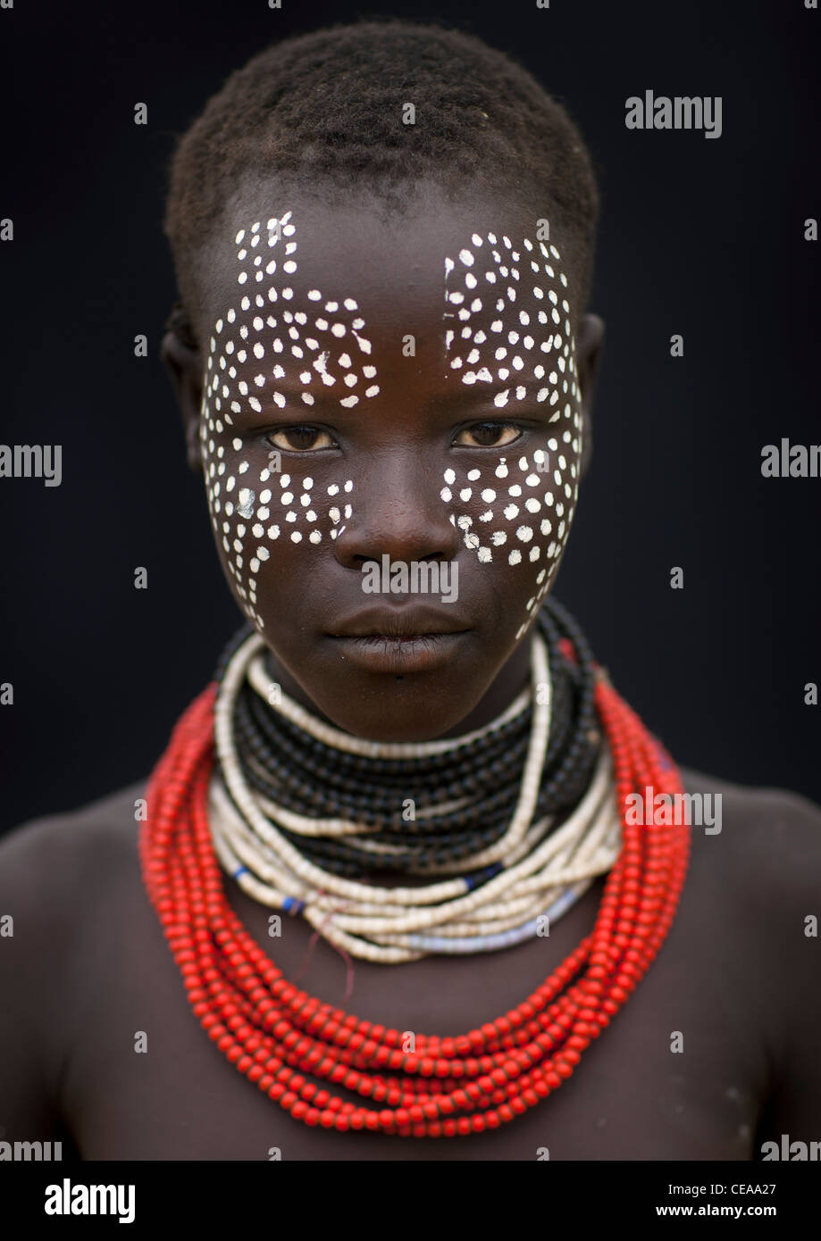Portrait Of Beautiful Dark Eyed Karo Woman With White Dots Painted On ...