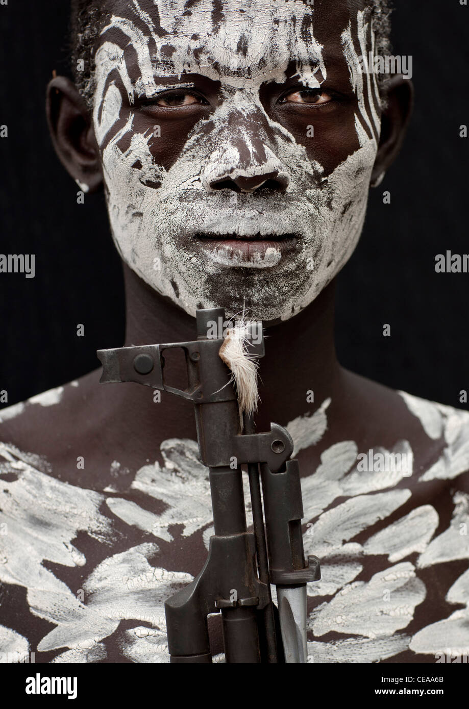 Portrait Of Painted Face Karo Young Man With White Paint And ...