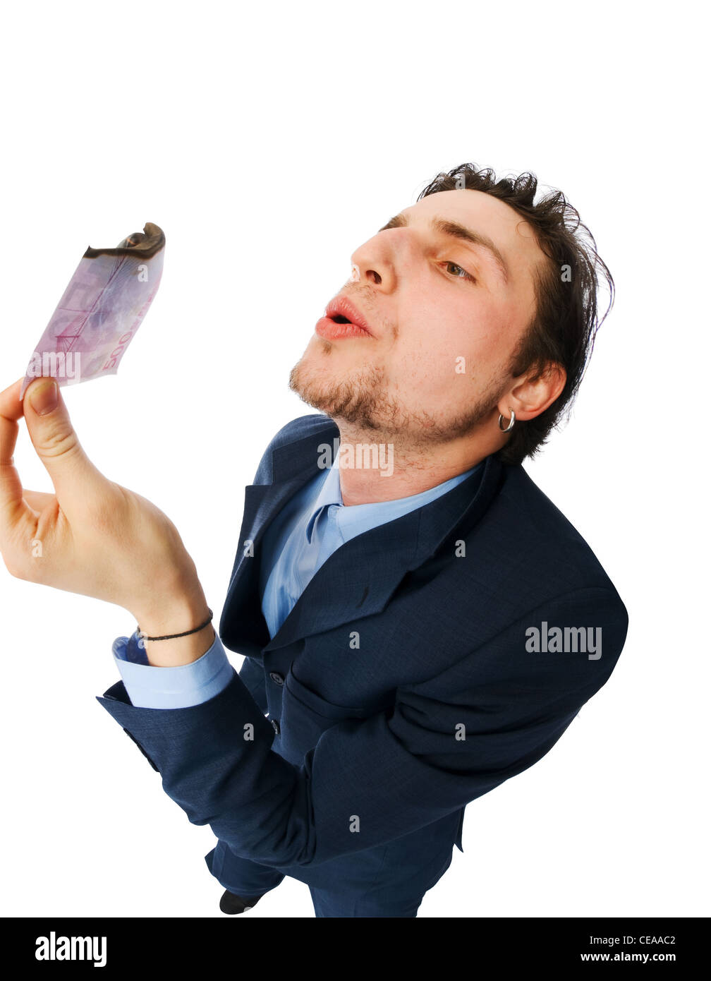 Successful businessman burning money isolated on white Stock Photo - Alamy