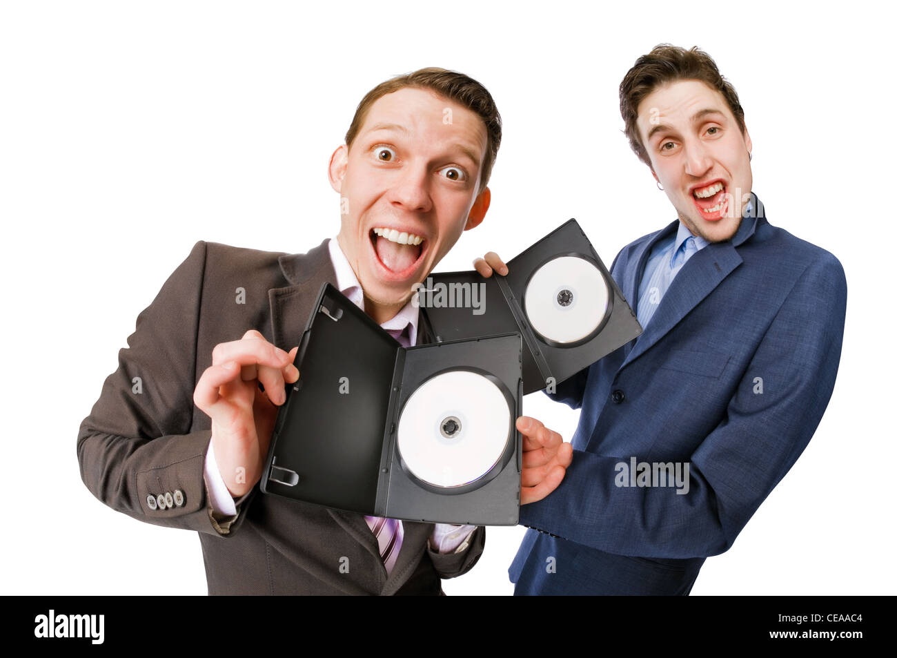 Two young people offering DVDs for sale on white background Stock Photo ...