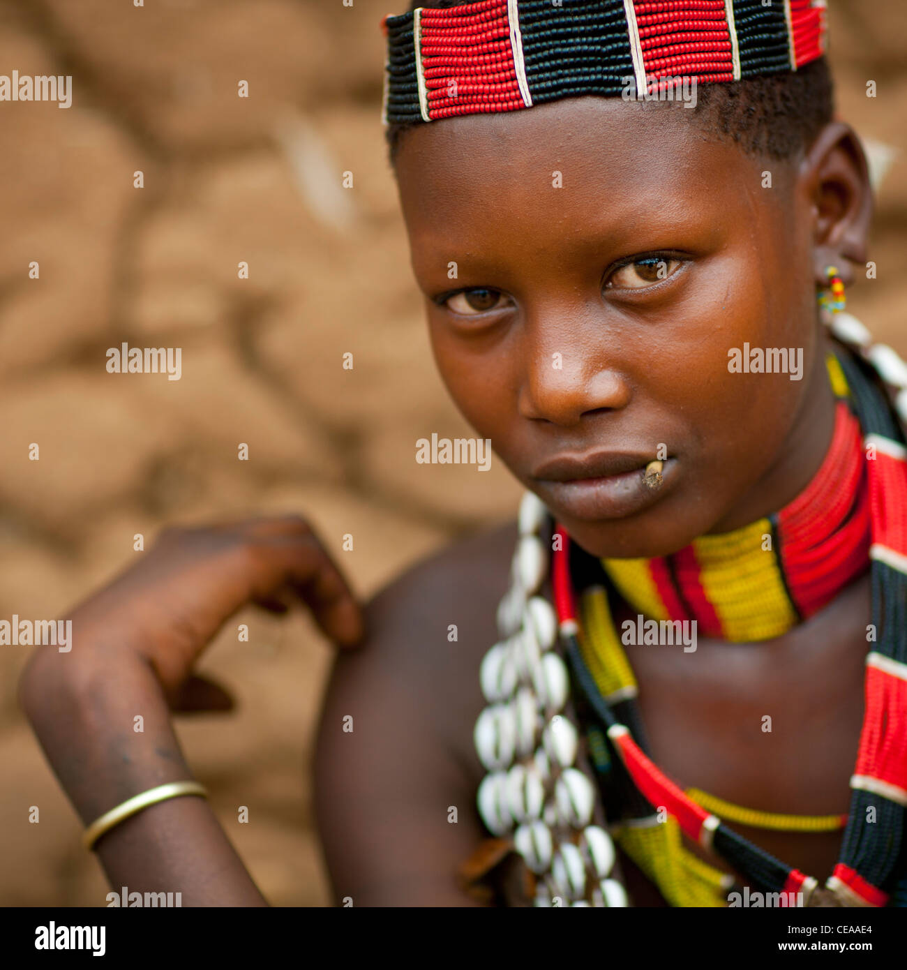 Portrait Of Hamer Beautiful Girl Posing In Front Of Clay House Omo ...