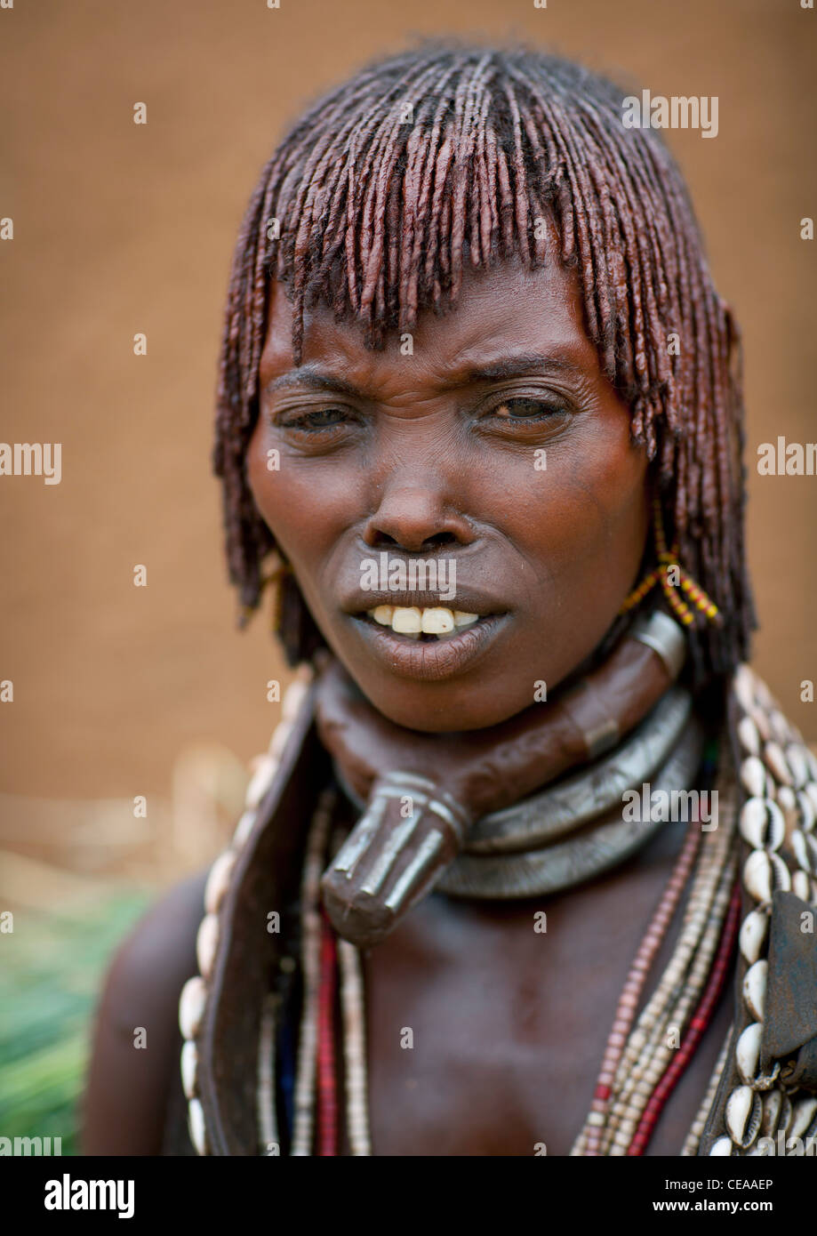Portrait Of Hamer Beautiful Woman Posing In Front Of Clay House Omo ...