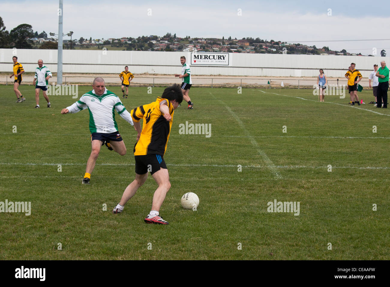 Tanzmania adults playing Gaelic Footy football Stock Photo - Alamy