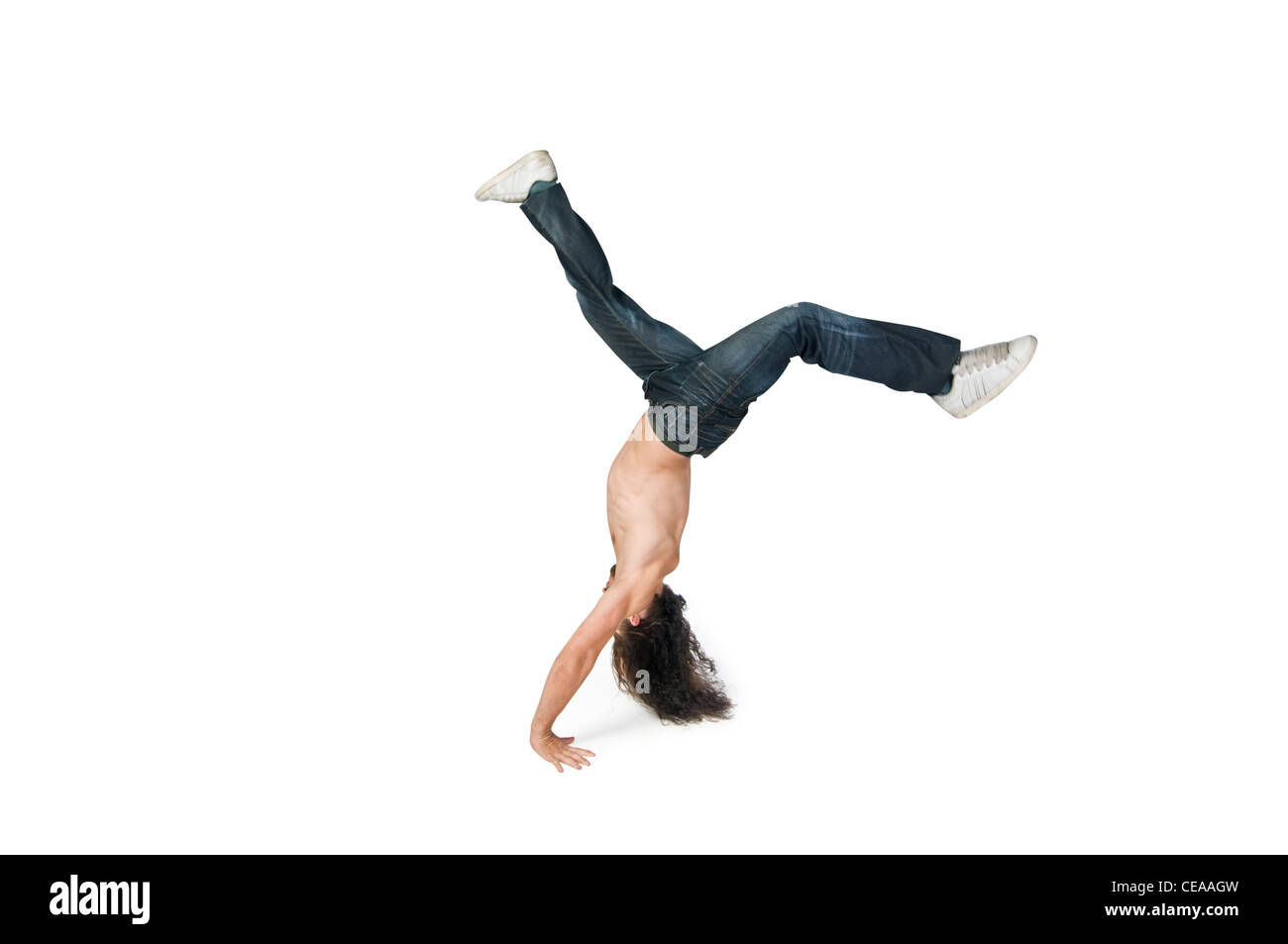 Young man performing a handstand on white background Stock Photo - Alamy