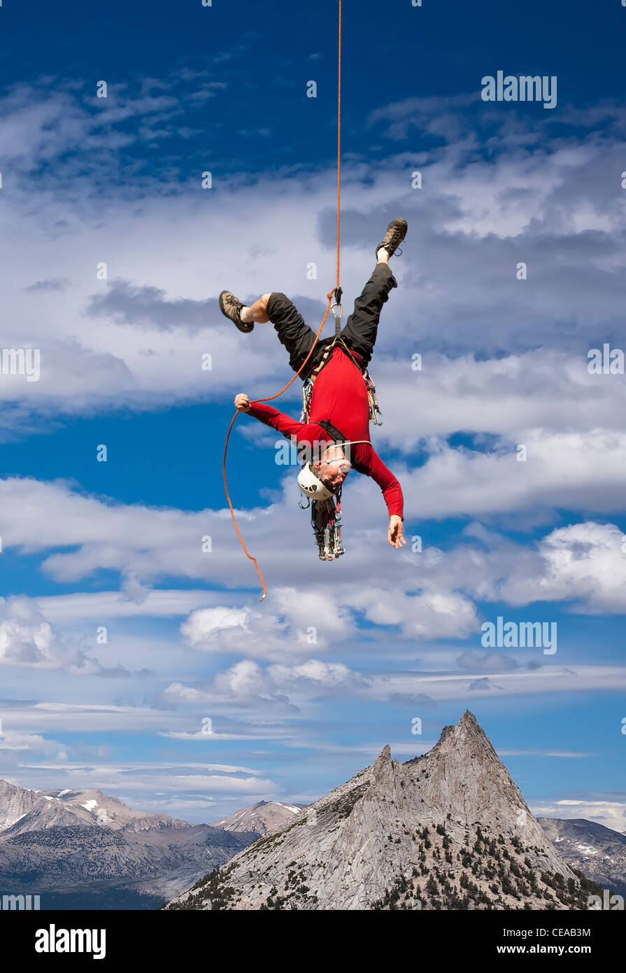Climber in trouble at the end of his rope Stock Photo - Alamy