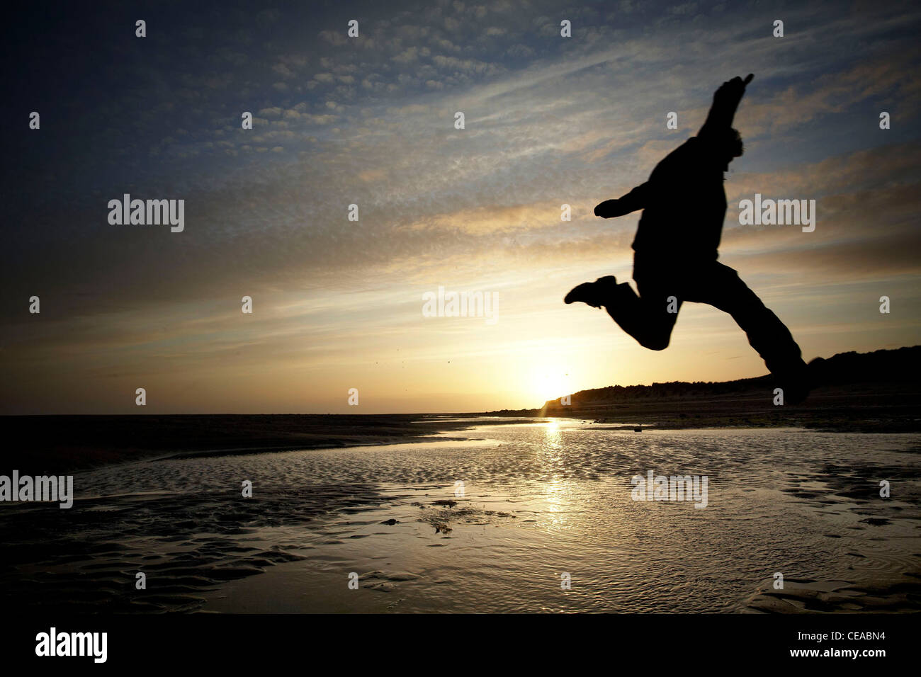 Jumping across waves hi-res stock photography and images - Alamy