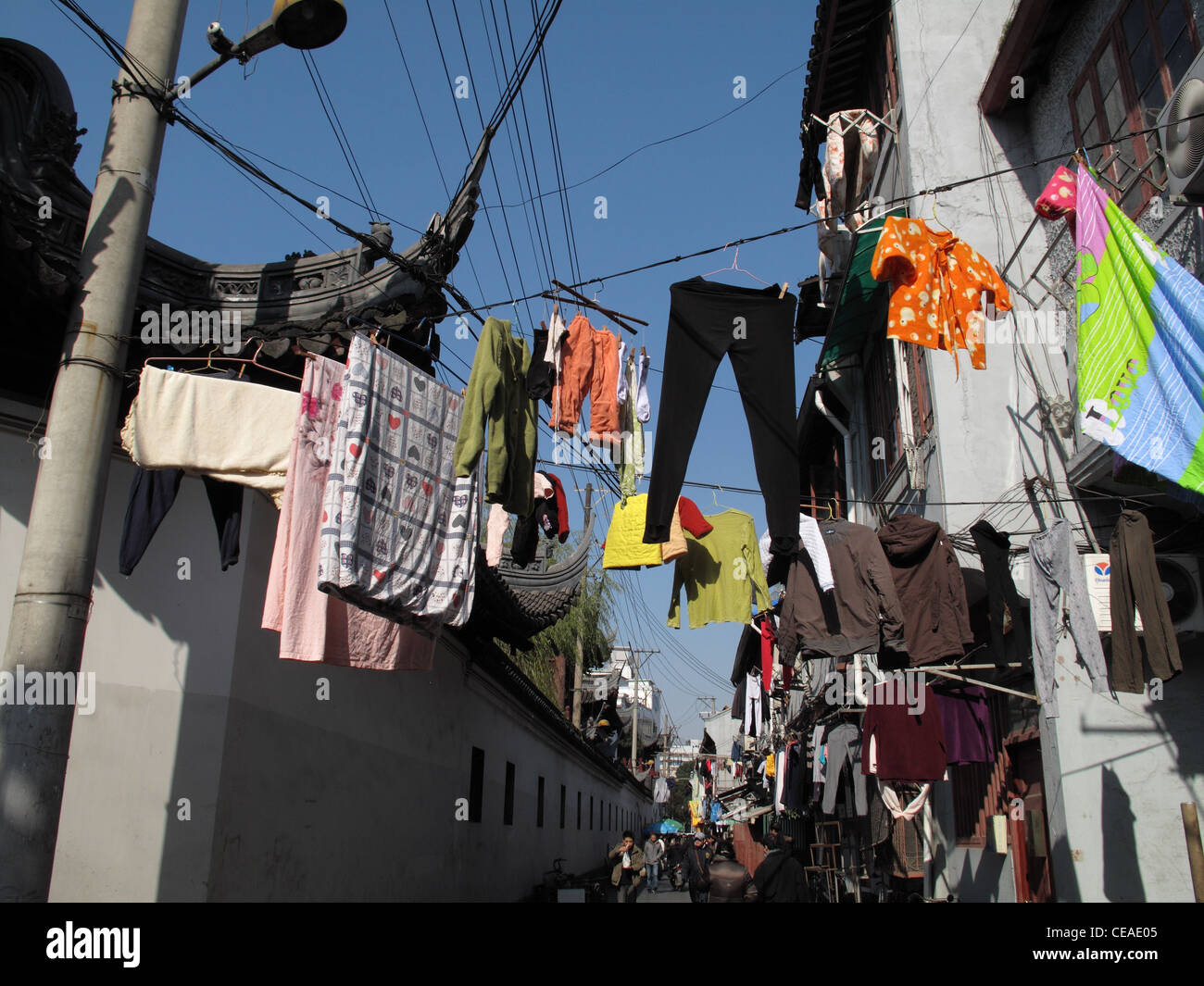 Clean laundry drying in a Shanghai street Stock Photo - Alamy