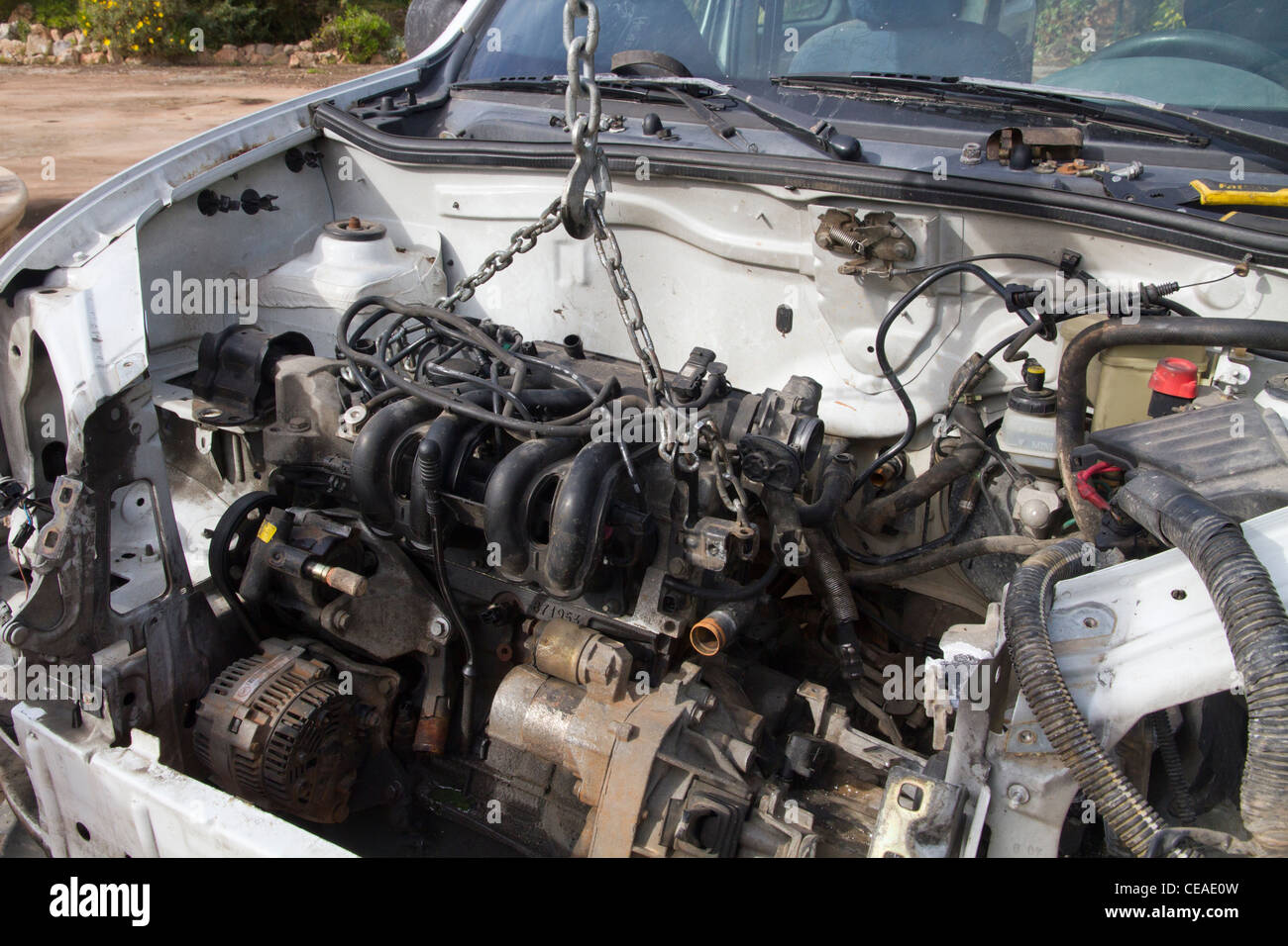 motor ripped out in broken car Stock Photo - Alamy