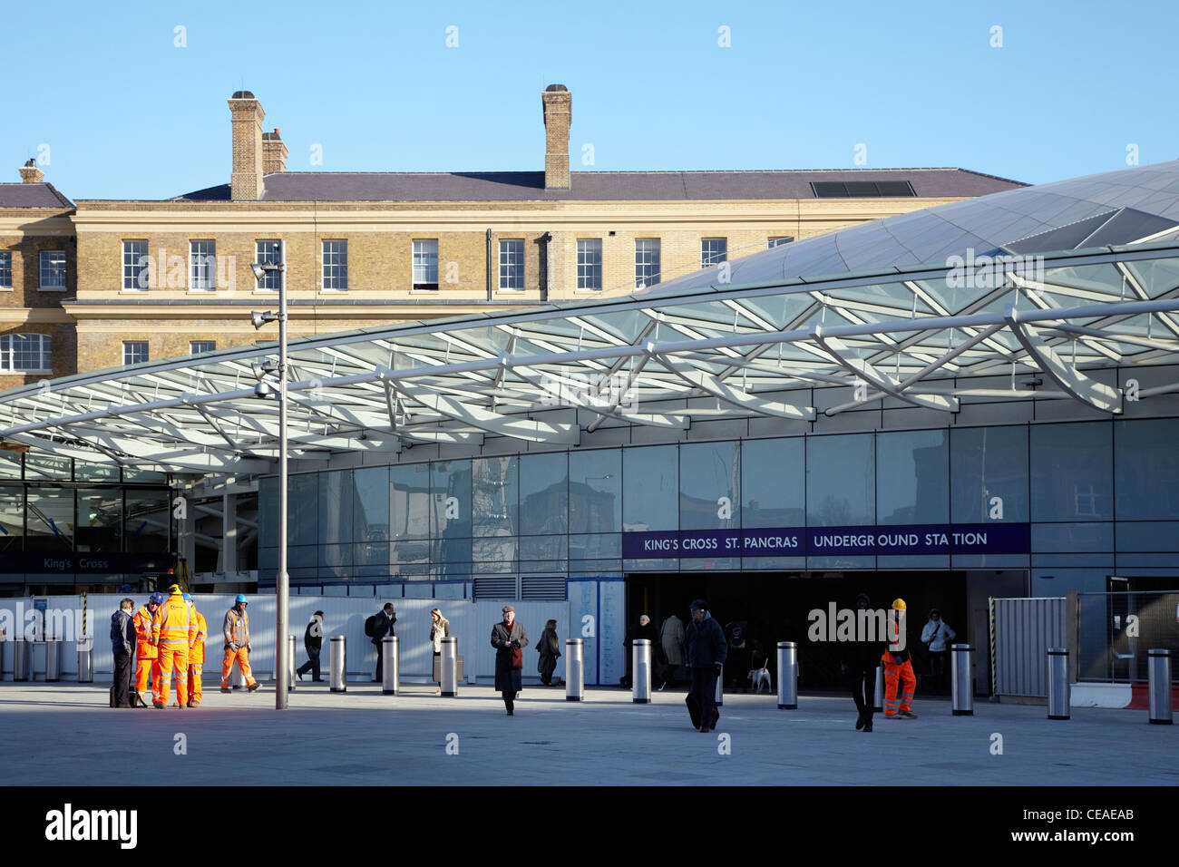 The new King's Cross station entrance, with the old station seen behind ...
