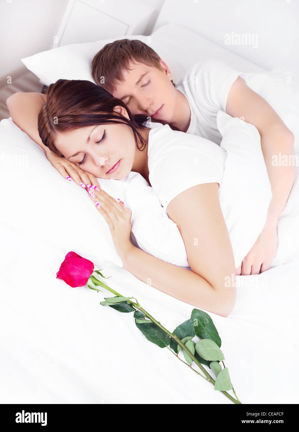 happy loving young couple in bed at home Stock Photo - Alamy