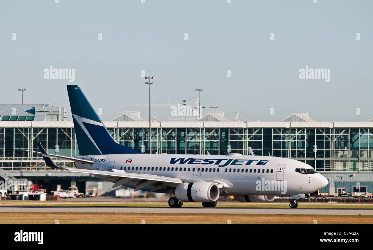 A Westjet Boeing 737 (700 series) jet airliner is seen as it lands at ...