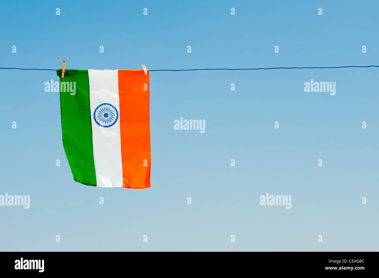 Indian flag on a washing line against a blue sky. Andhra Pradesh, India ...