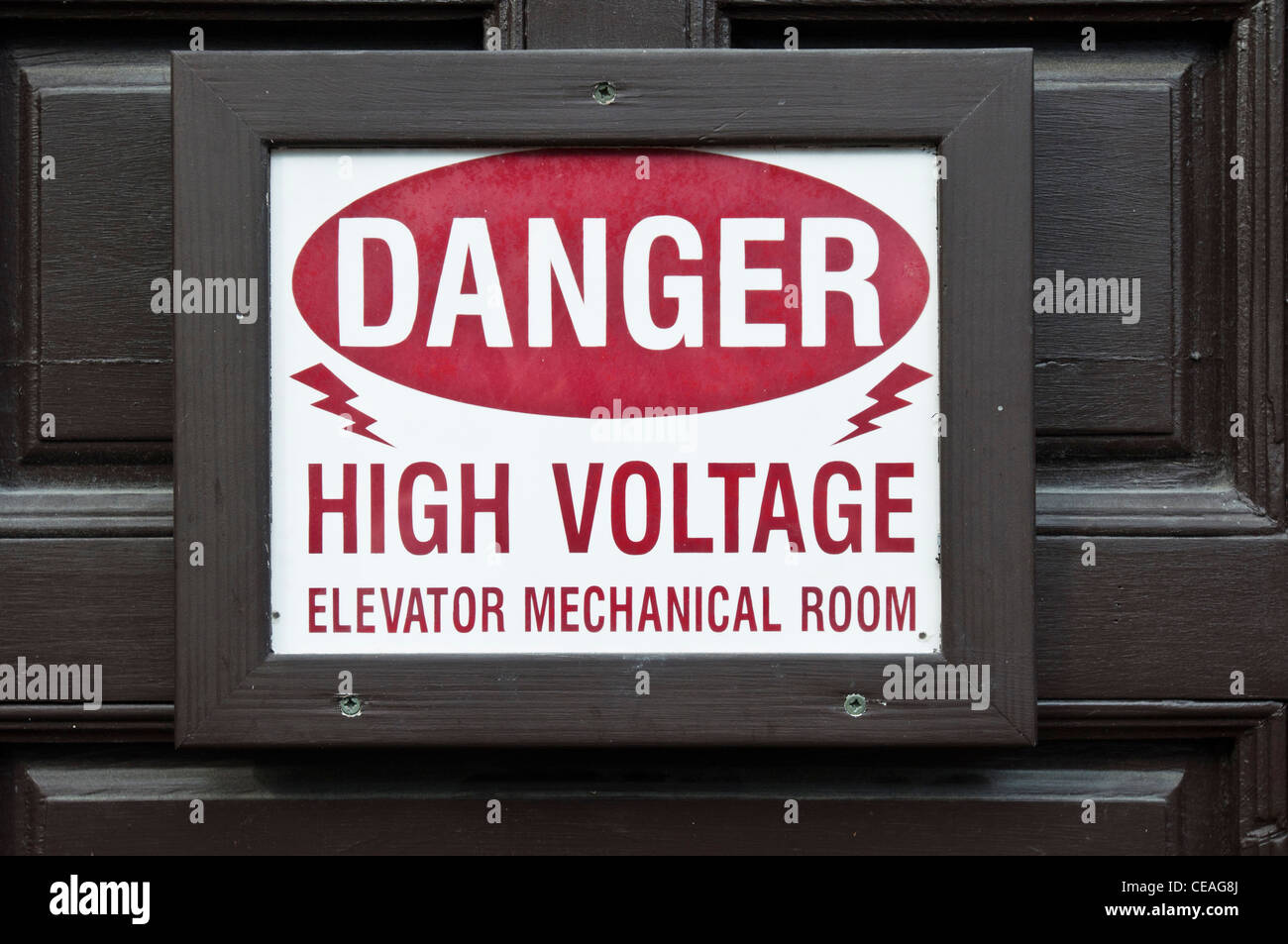 Danger high voltage elevator mechanical room door sign hi-res stock ...