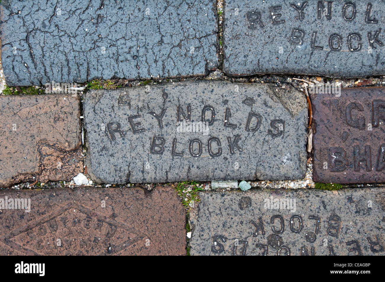 Old brick used as sidewalk stones with signs, St Augustine, Florida ...