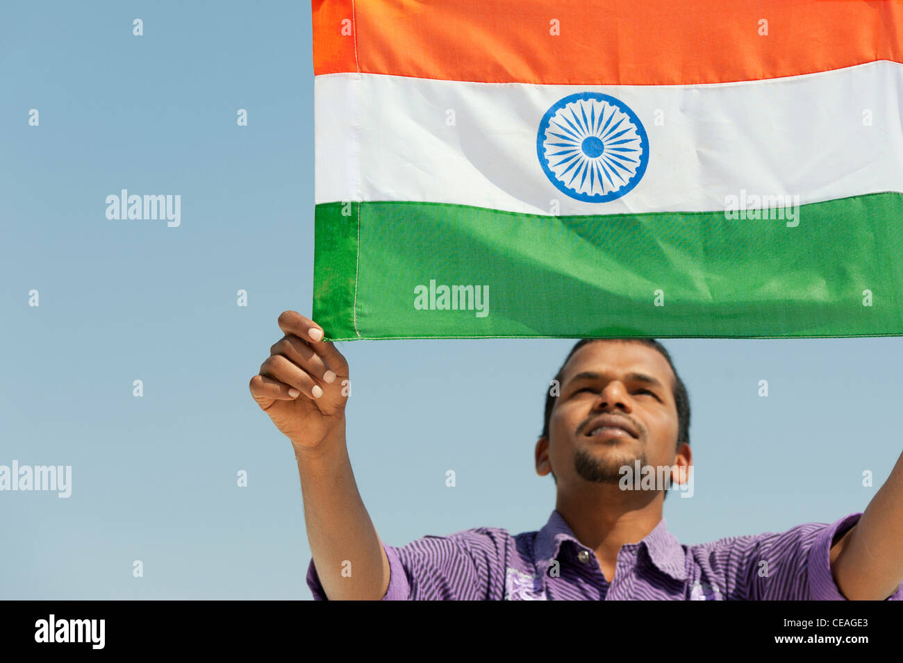 Indian man holding an Indian flag. Andhra Pradesh, India Stock Photo ...