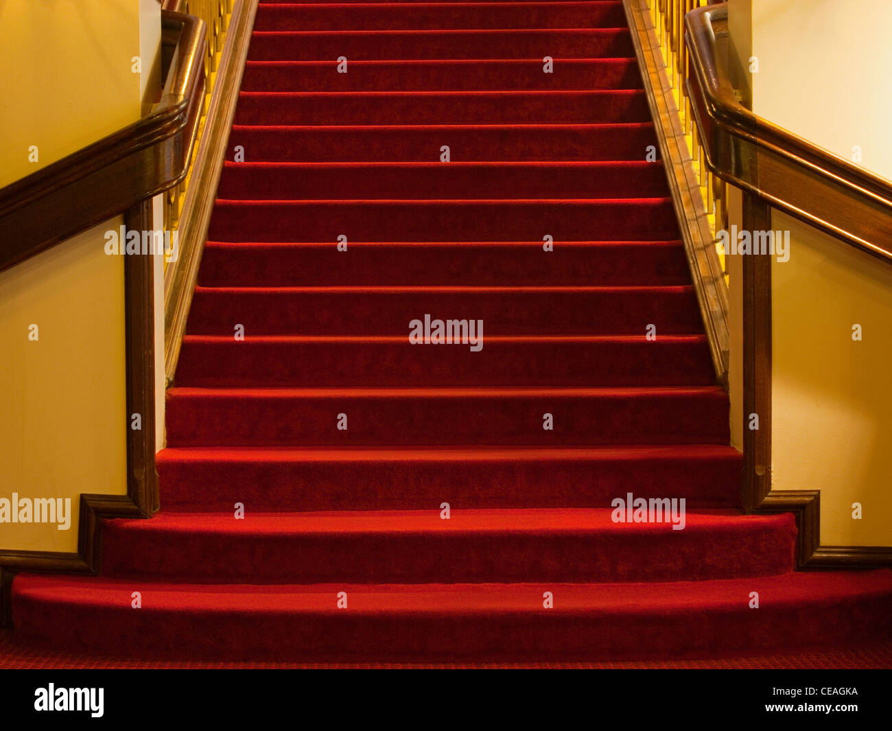Steps with red carpet from an old mansion, hotel, theater or opera ...