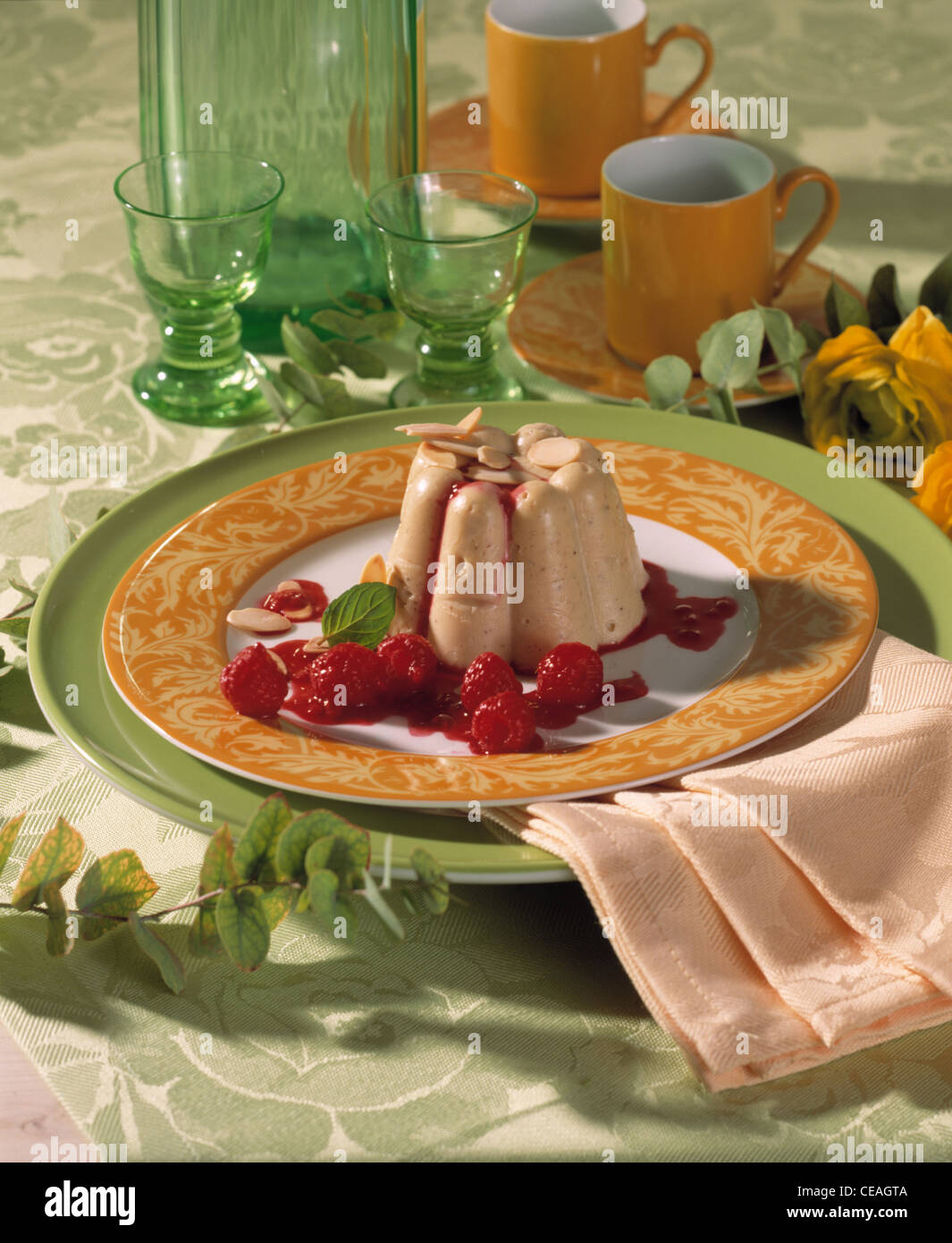 Bourbon - vanilla pudding with hot raspberries Stock Photo - Alamy